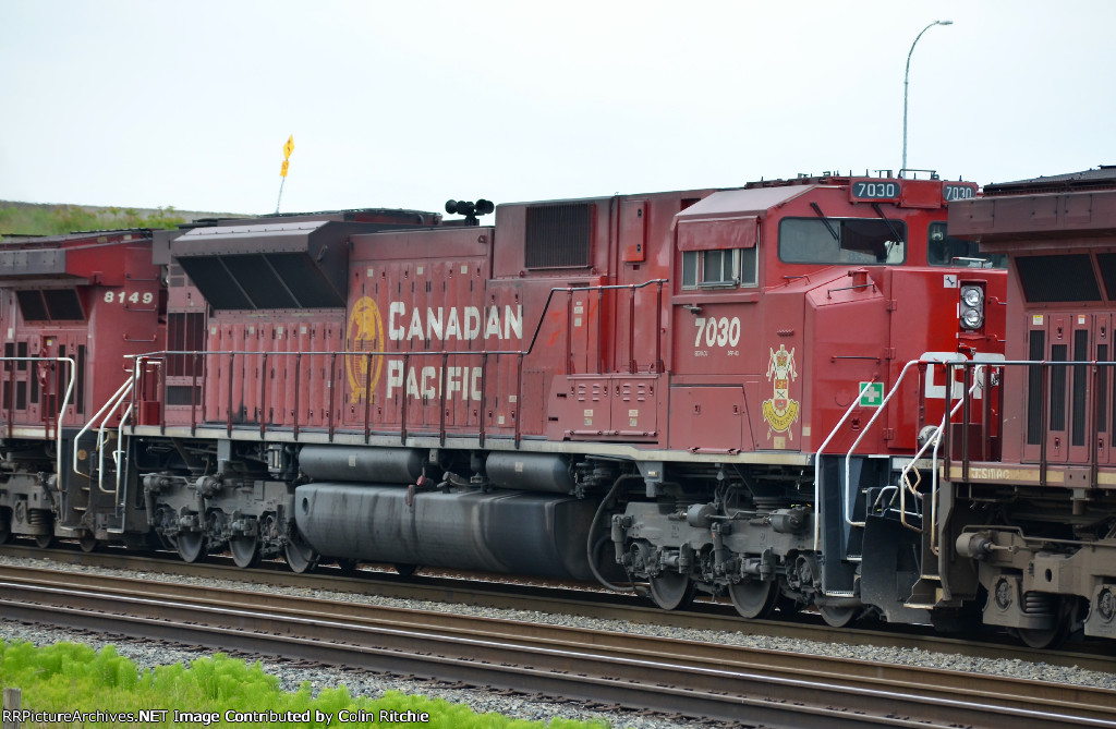 CP 7030/8149/8006 with a unit stack train awaiting W/B departure from Fisher Siding